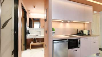 Apartamento Executivo | Cozinha privada | Um frigorífico, um micro-ondas, um forno, uma placa de cozinha