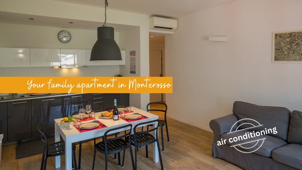 Apartamento para família em Monterosso, com sala de jantar, cozinha e sala de estar.