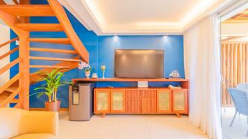 Apartamento | Sala de estar | TV de ecrã plano