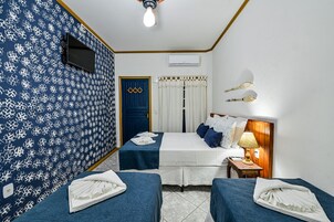 Suite Standard Quadrupla | Frigobar, Wi-Fi de cortesia, roupa de cama