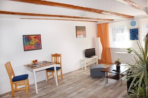 Apartamento, 1 quarto, vista para o jardim | Sala de estar