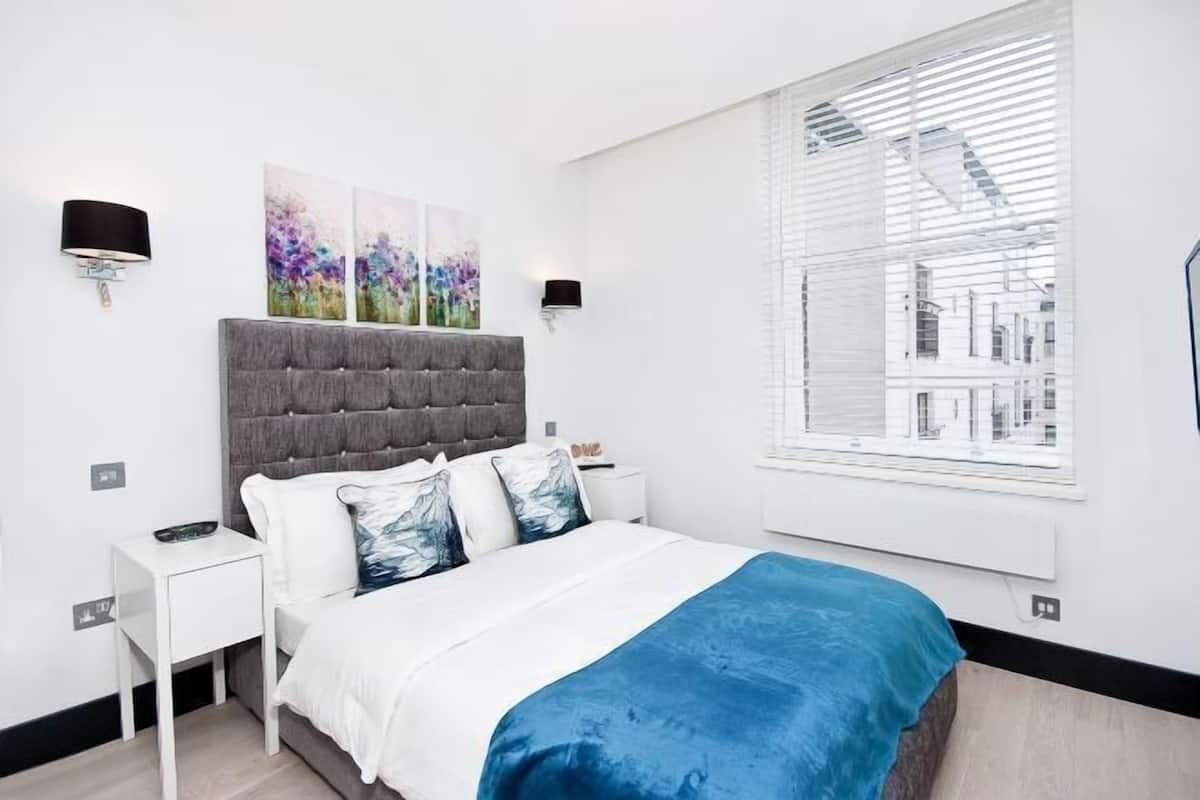 1 quarto, roupas de cama premium, espaço de trabalho para notebook
