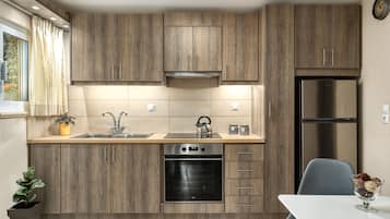 Apartamento de Luxo | Uma placa de cozinha, uma cafeteira/bule, uma torradeira