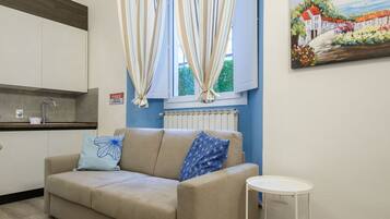 Apartamento clássico | Área de estar | TV