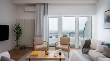 Apartamento conforto, 3 quartos | Área de estar | TV de tela plana