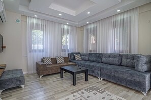 Villa Deluxe | Sala de estar | Televisor LCD 