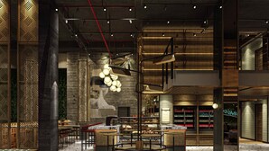 Um interior moderno com uma área de estar circular central, tetos altos com vigas aparentes e uma combinação de iluminação natural e artificial.