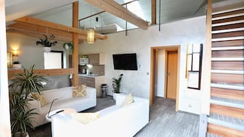 Apartamento Superior | Sala | Televisor LED de 51 polegadas com canais por cabo, televisor