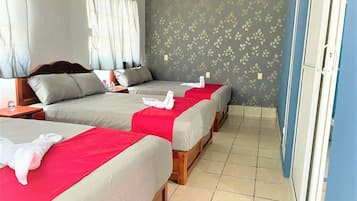 Quarto quádruplo exclusivo, várias camas, para não fumantes, vista para a praia | Wi-Fi de cortesia, roupa de cama