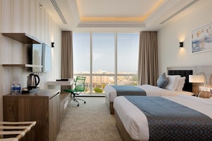 Quarto Twin Deluxe | Minibar, secretária, quartos insonorizados, Wi-fi grátis 