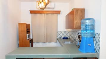 Quarto quádruplo família, 1 quarto | Cozinha privada | Frigobar, micro-ondas, cooktop, liquidificador