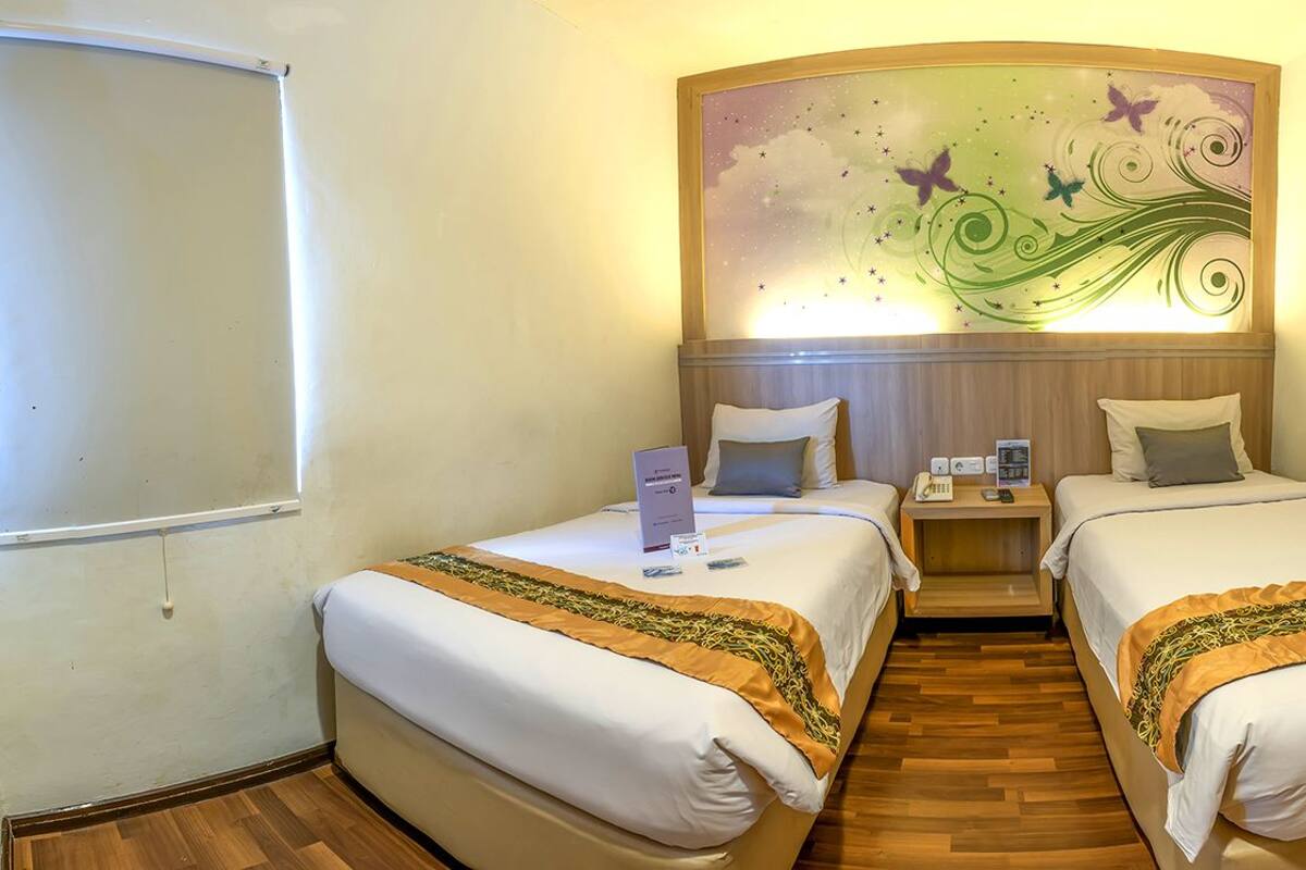 Quarto Deluxe | Minibar, cofre no quarto, secretária, Wi-fi grátis