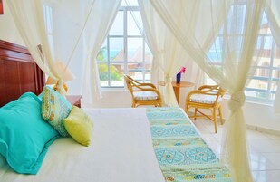 Suite Familiar, 2 quartos, vista parcial para o oceano | Wi-fi grátis, roupa de cama fornecida 