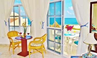 Suite Deluxe, 1 quarto, cozinha, vista parcial para o oceano | Sala