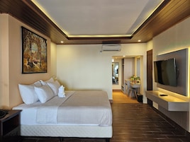 Quarto Deluxe, vista para o mar, junto à praia | Minibar, cofre no quarto, secretária, cortinas/cortinados opacos