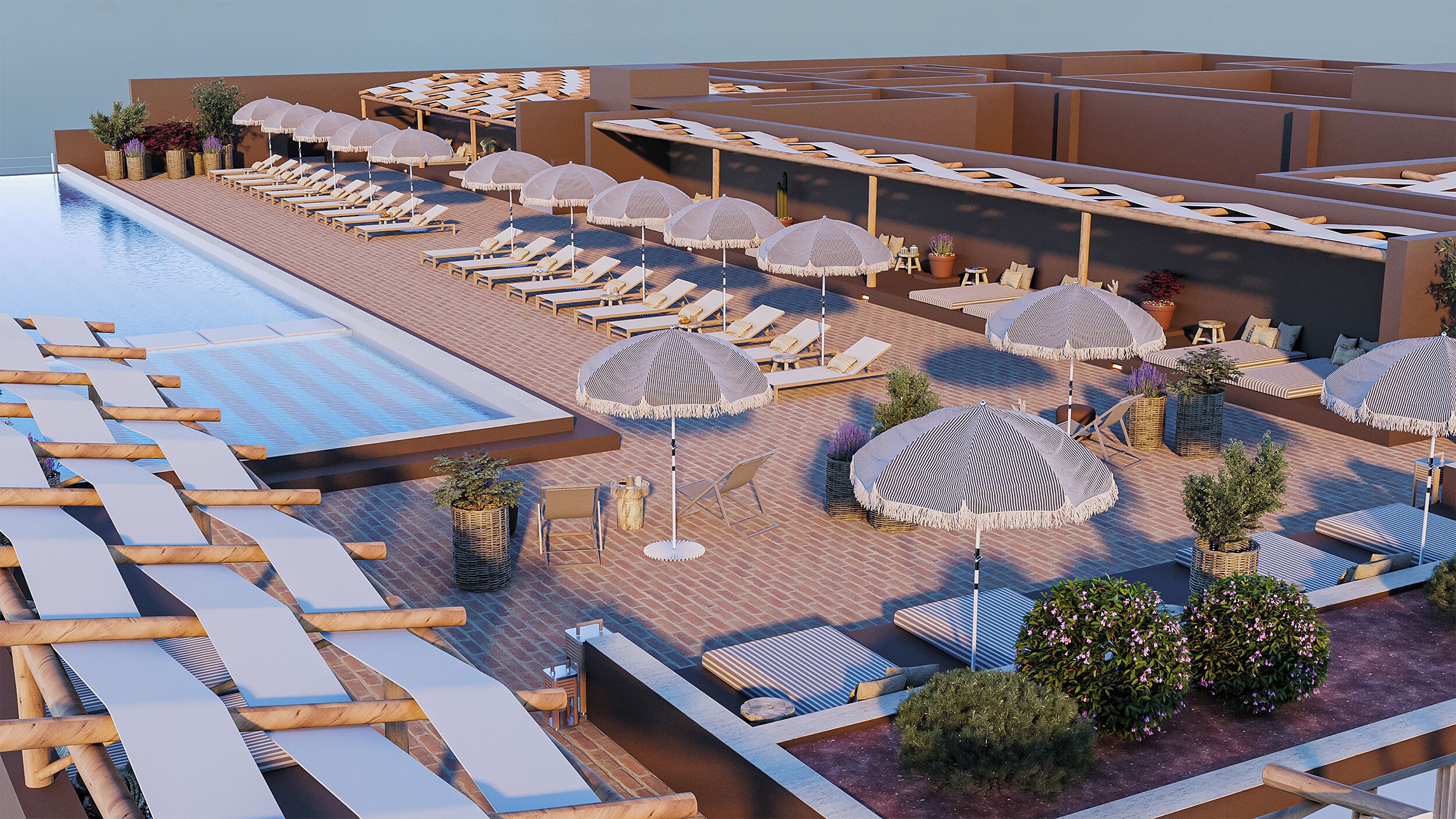 Área de piscina no terraço com espreguiçadeiras e guarda-sóis.