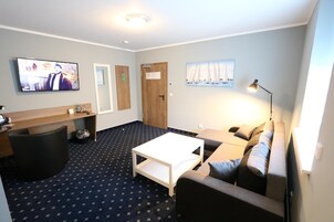 Apartamento Empresarial | Sala | Televisor LED, tablet, Netflix, serviços de streaming 