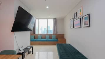 Apartamento, 1 quarto | Área de estar | TV