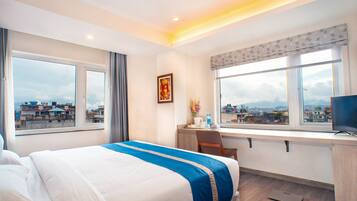 Deluxe King or Twin Room | Roupa de alta qualidade, minibar, cofre no quarto