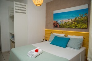Apartamento Deluxe | Minibar, Wi-fi grátis, roupa de cama fornecida 