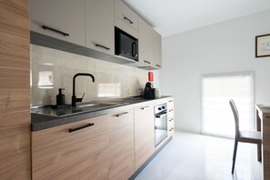 Dúplex Cidade | Cozinha privada | Uma cafeteira/bule