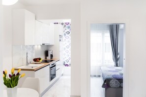 Apartamento standard | Área de estar | TV