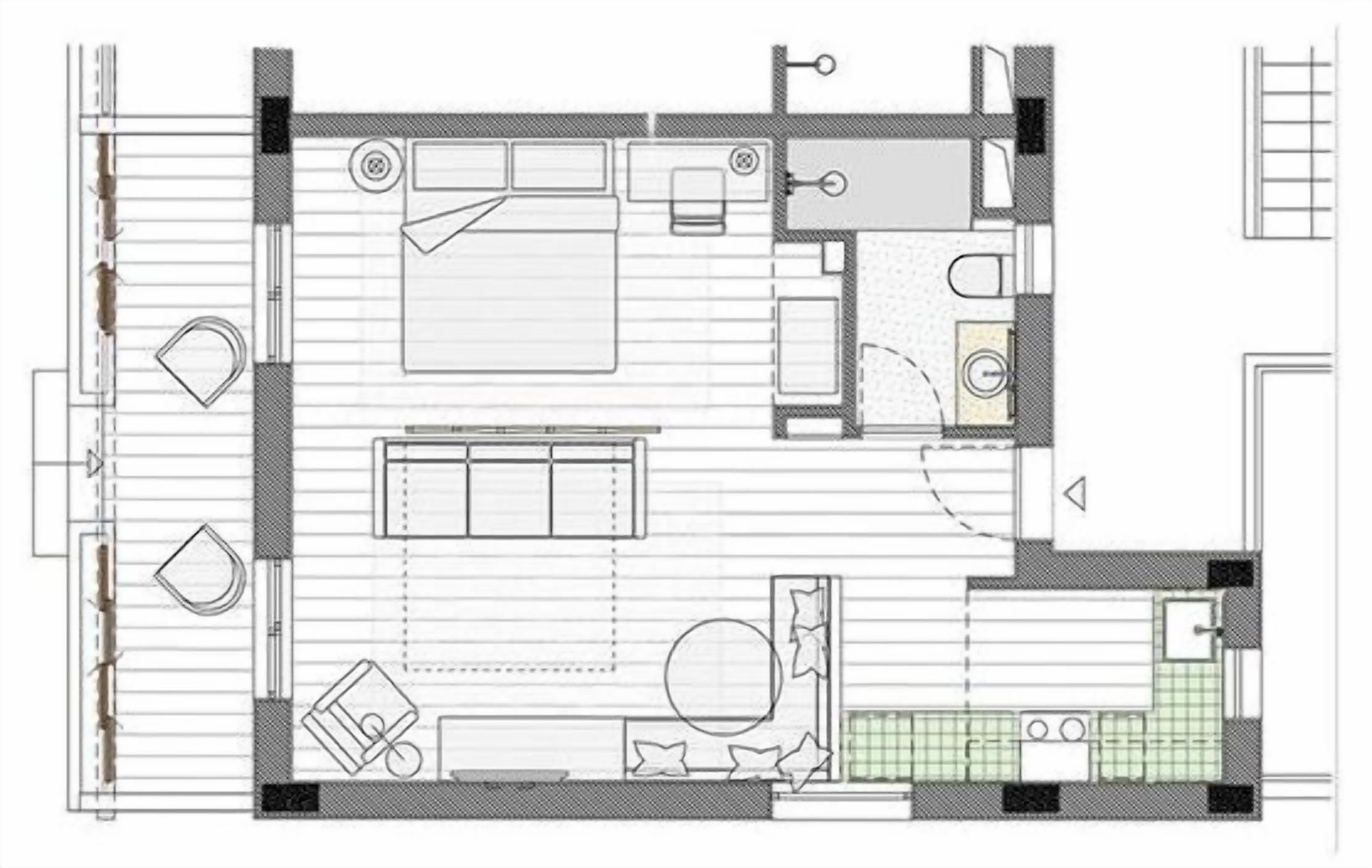 Planta baixa de um quarto de hotel com cama, escrivaninha, cadeira, mesa pequena, sofá, banheiro e cozinha compacta.