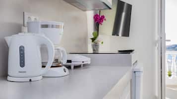 Apartamento luxo | Cozinha privada | Geladeira grande, cooktop, máquina de café expresso, cafeteira/chaleira