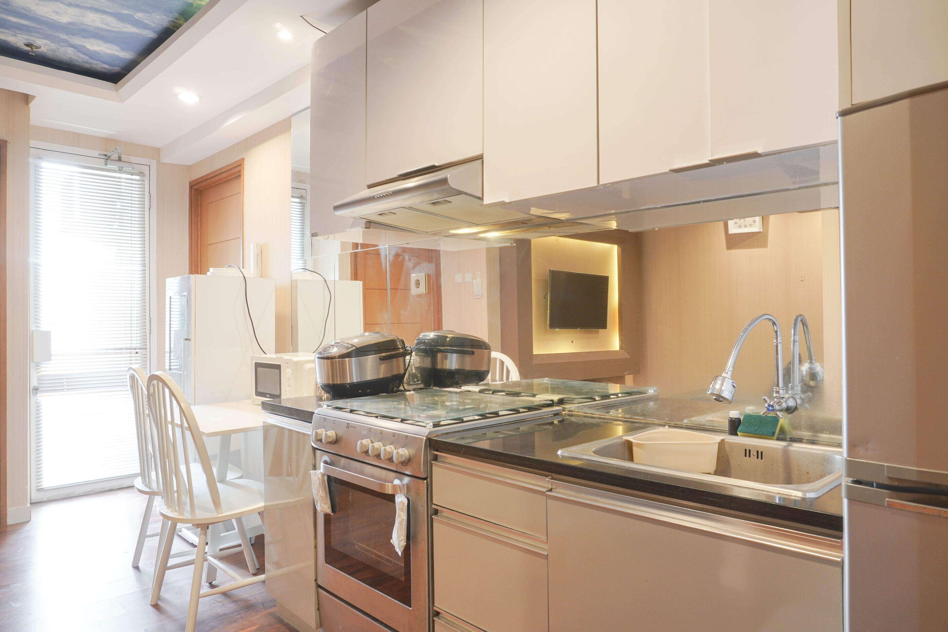 Apartamento, 2 quartos | Cozinha privada | Geladeira, cooktop, talheres/pratos/utensílios de cozinha