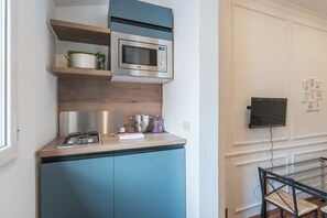 Apartamento, 1 cama de casal e sofá-cama | Cozinha americana privada | Geladeira, fogão, cooktop, lava-louças