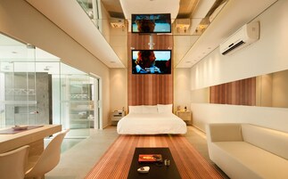 Quarto luxo | Frigobar, cortinas blackout, Wi-Fi de cortesia, roupa de cama