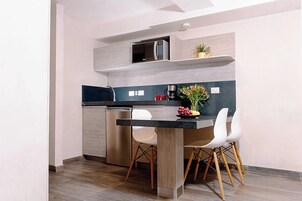 Suíte executiva, 1 quarto | Cozinha privada