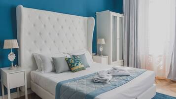 Quarto Triplo Deluxe | Minibar, cortinas/cortinados opacos, Wi-fi grátis