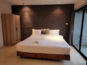 Quarto casal superior | Cortinas blackout, roupa de cama