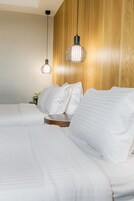 Quarto Twin Deluxe | Roupa de cama fornecida 