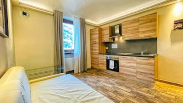 Apartamento Familiar em Condomínio Fechado, 2 quartos, na torre (5 people) | Sala de estar | Televisor de ecrã plano de 70 cm com canais digitais, televisor