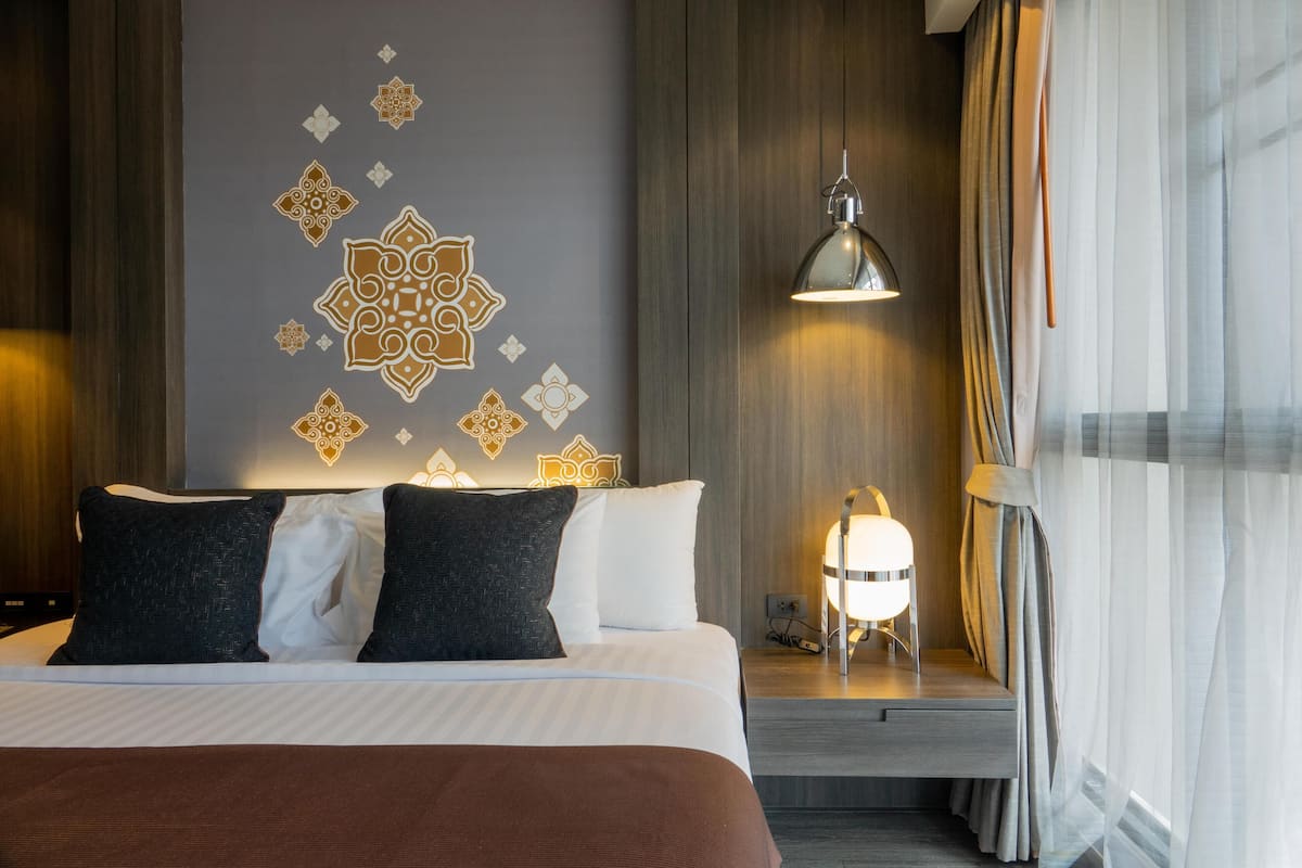 Suite, várias camas, não fumadores, varanda | Roupa de alta qualidade, minibar, cofre no quarto, secretária