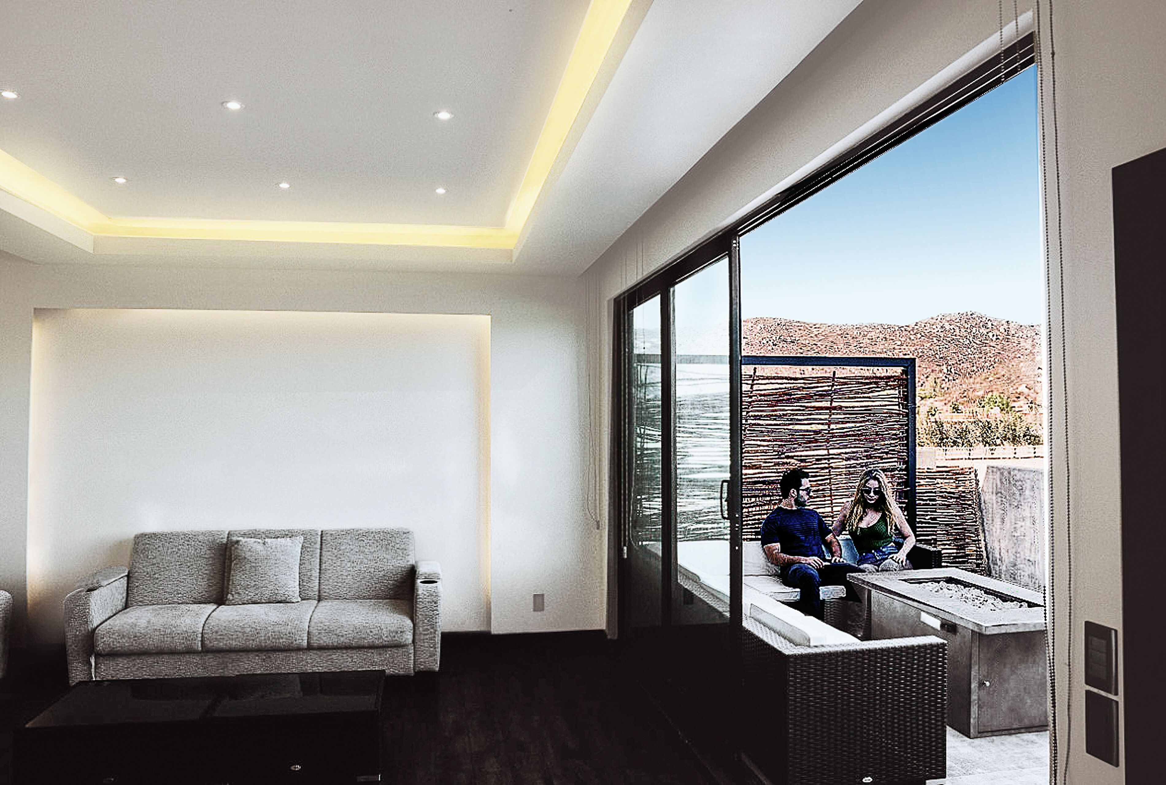 Uma sala de estar moderna com um sofá, porta de vidro que dá para uma área de estar externa com vista para uma paisagem montanhosa.