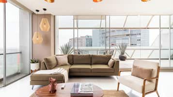 Apartamento exclusivo | Área de estar | TV LED 50 polegadas com canais a cabo, TV