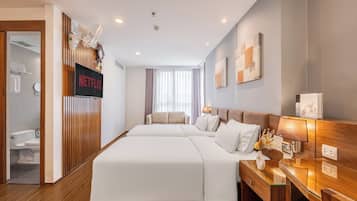 Quarto Deluxe | Minibar, cofre no quarto, ferro/tábua de engomar, Wi-fi grátis