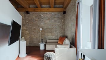 Quarto Deluxe | Sala de estar | Smart TV de 55 polegadas com canais digitais, televisor