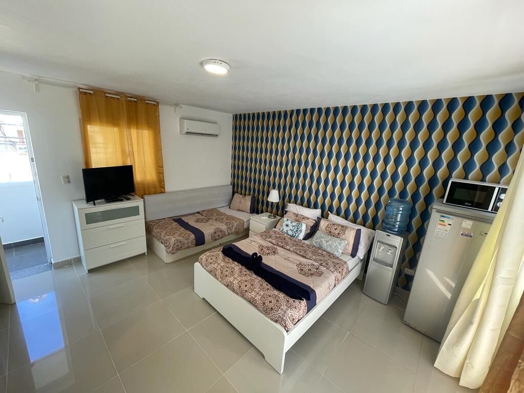 Apartamento Deluxe, várias camas, vista para a piscina | Edredões de penas, com decoração personalizada, Wi-fi grátis 