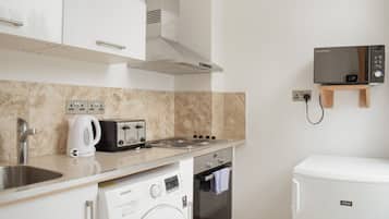 Apartamento premium | Cozinha privada | Frigobar, micro-ondas, fogão, torradeira