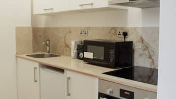 Apartamento executivo | Cozinha privada | Frigobar, micro-ondas, fogão, torradeira