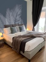 Apartamento família | 2 quartos, cortinas blackout, berço de viagem, Wi-Fi de cortesia