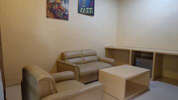 Quarto Duplo Deluxe | Sala de estar