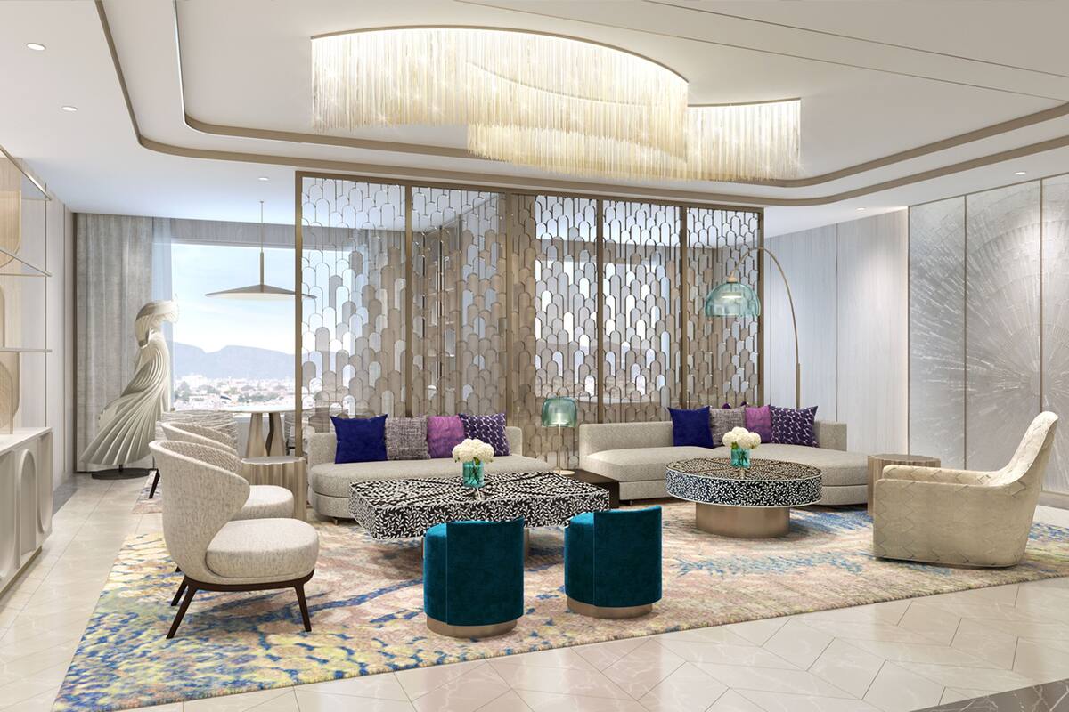 Uma sala de estar moderna com sofá, pufes, mesa de centro e uma escultura decorativa.