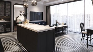 Uma cozinha moderna com ilha central, iluminação pendente e área de refeições com mesa e cadeiras.