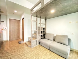 Apartamento Deluxe | Sala de estar