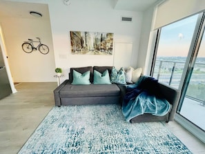 Apartamento panorâmico | Área de estar | Smart TV 55 polegadas com canais digitais, TV, Netflix